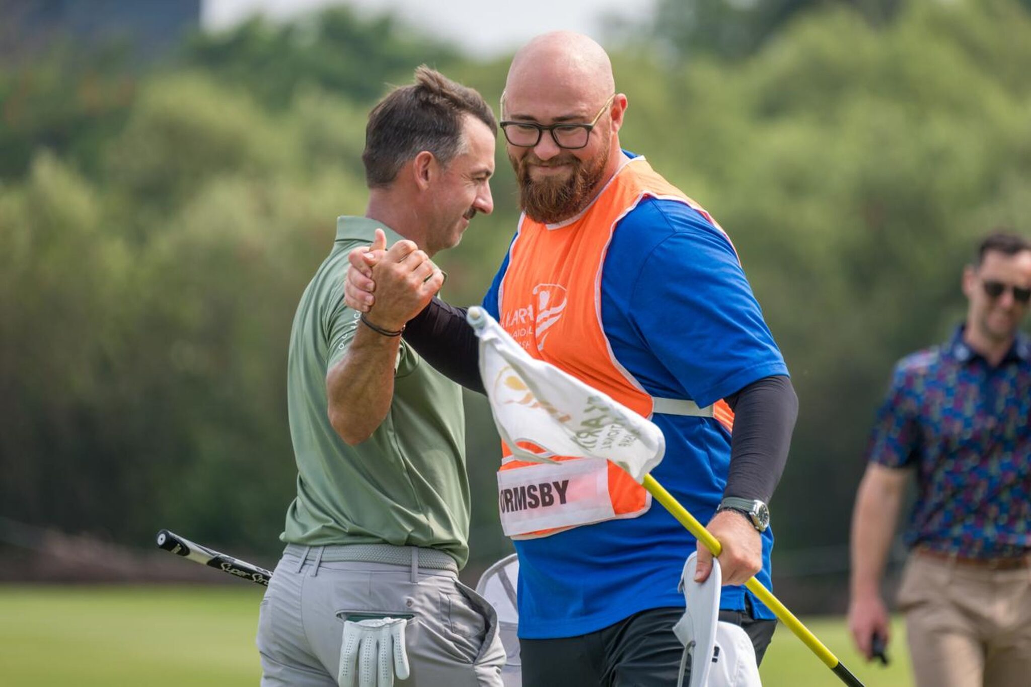 Wade Ormsby and his caddie celebrate the win.